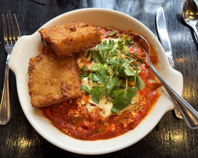 Shakshuka that brings Middle Eastern tradition to the brunch table, with perfectly poached eggs swimming in a sea of spiced tomato bliss.