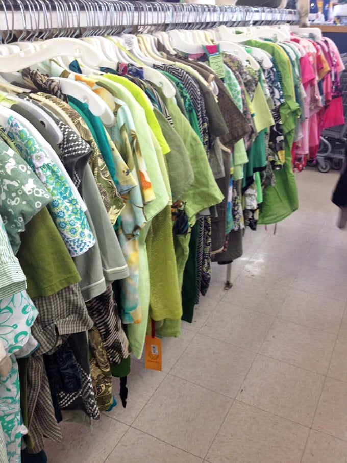 The shirt section: organized by color like a wearable rainbow. Pittsburgh practicality meets unexpected fashion finds in this technicolor display.