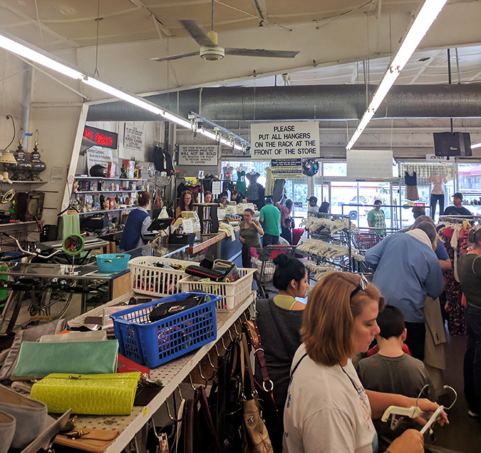 The thrill of the hunt brings shoppers together in communal treasure-seeking, each cart filling with personal victories and unexpected finds.