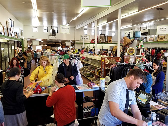 The checkout area buzzes with community energy as shoppers and staff share in the joy of sustainable shopping.