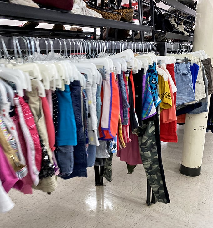 Children's clothing arranged with military precision – tiny fashion statements waiting for their next adventure.