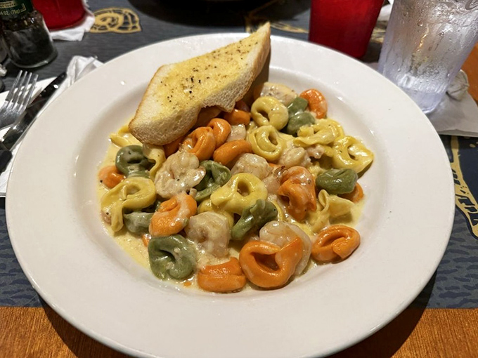 Colorful tortellini swimming in a creamy sauce with shrimp&mdash;like little pasta life preservers in a sea of deliciousness you'll want to dive into.