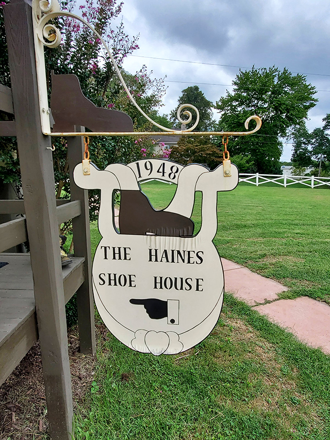 Established in 1948, the sign swings as a charming welcome to visitors. It points the way forward, though honestly, you can't exactly miss a giant shoe.