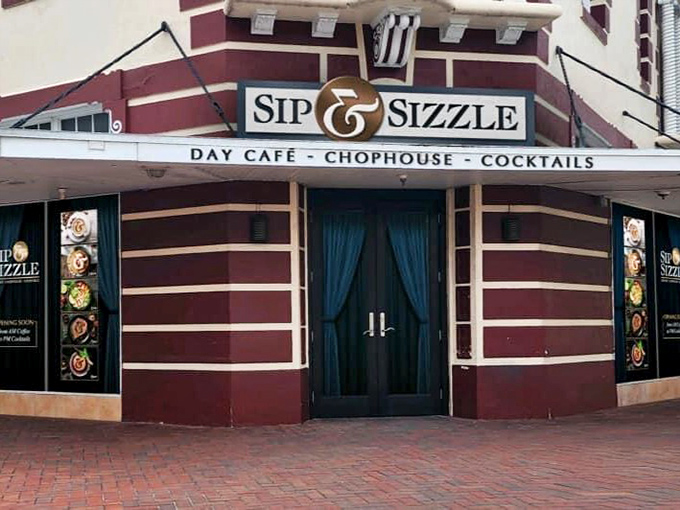 Sip & Sizzle's distinctive corner entrance beckons with the promise of cocktails and conversation&mdash;a grown-up reward after a day of Florida exploration.
