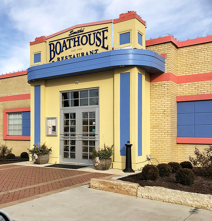 Smith's Boathouse Restaurant brings Art Deco flair to riverside dining, its cheerful yellow exterior as inviting as a summer afternoon.