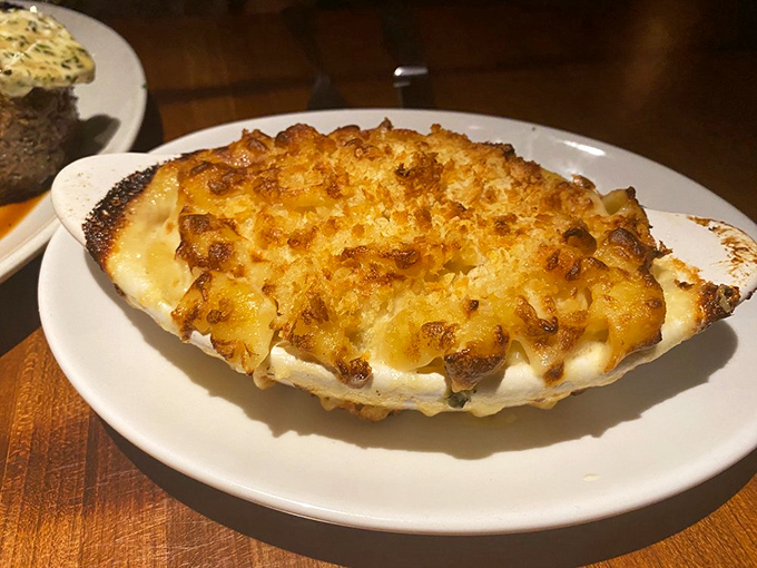 This isn't just mac and cheese &ndash; it's a bubbling cauldron of smoked Gouda decadence that renders conversation impossible for at least three bites.