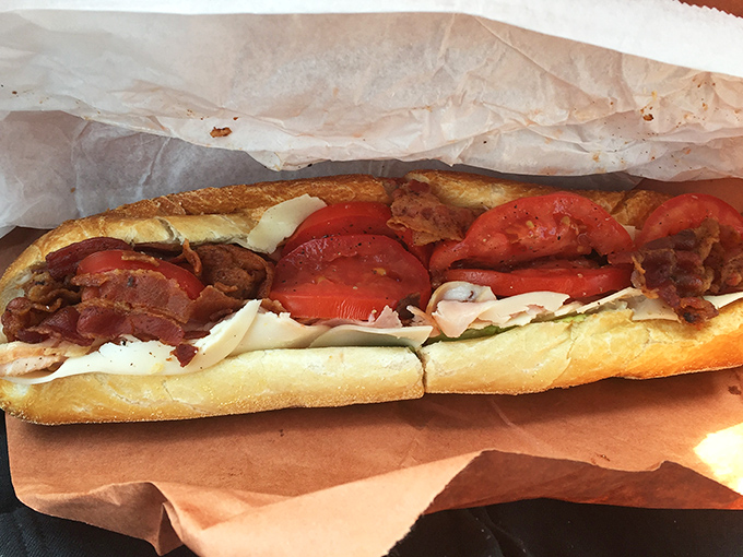 The South Philly Hot Roast Pork: where tender meat, sharp provolone, and roasted red peppers create a holy trinity of sandwich perfection.