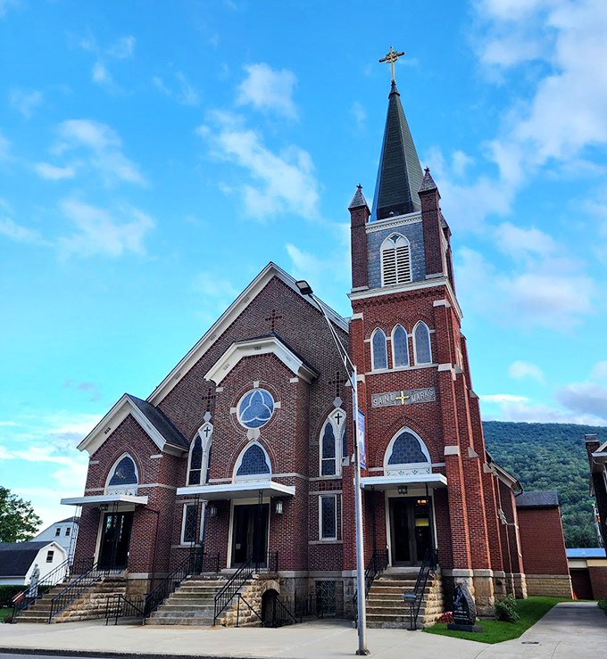 St. Mark's brick spire reaches skyward like an architectural exclamation point, marking Sundays and celebrations in Emporium for generations.