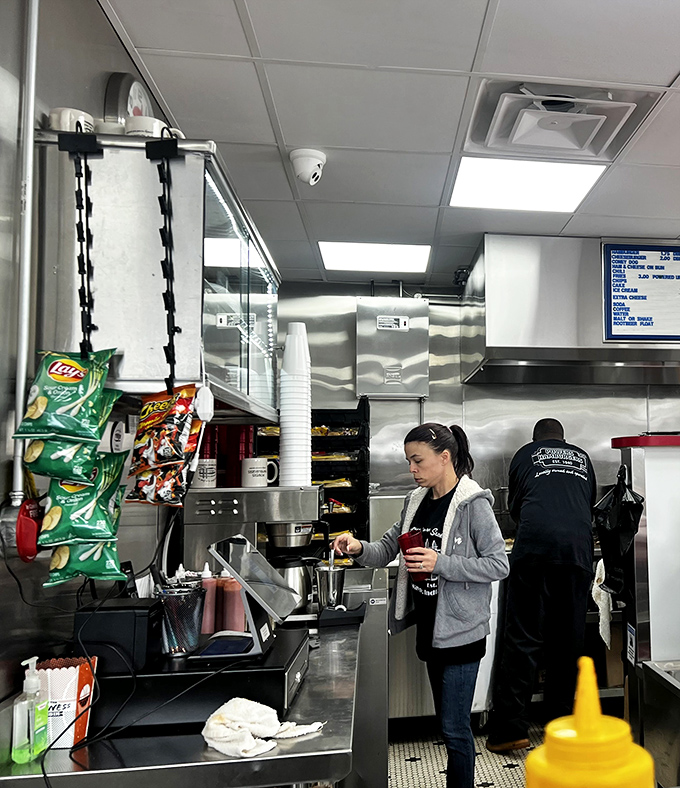 The kitchen staff moves with the choreographed precision that comes only from years of practice, turning out sliders faster than you can say "I'll have another."