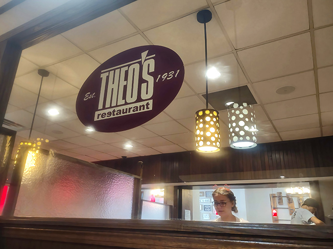 That iconic ceiling sign reminds you this place has history—established in 1931, it's been perfecting its recipes while the world outside has changed.