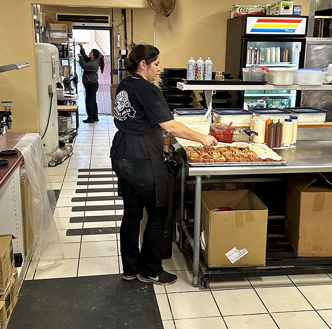 Behind every great cinnamon roll is a dedicated baker. The magic happens in these capable hands.