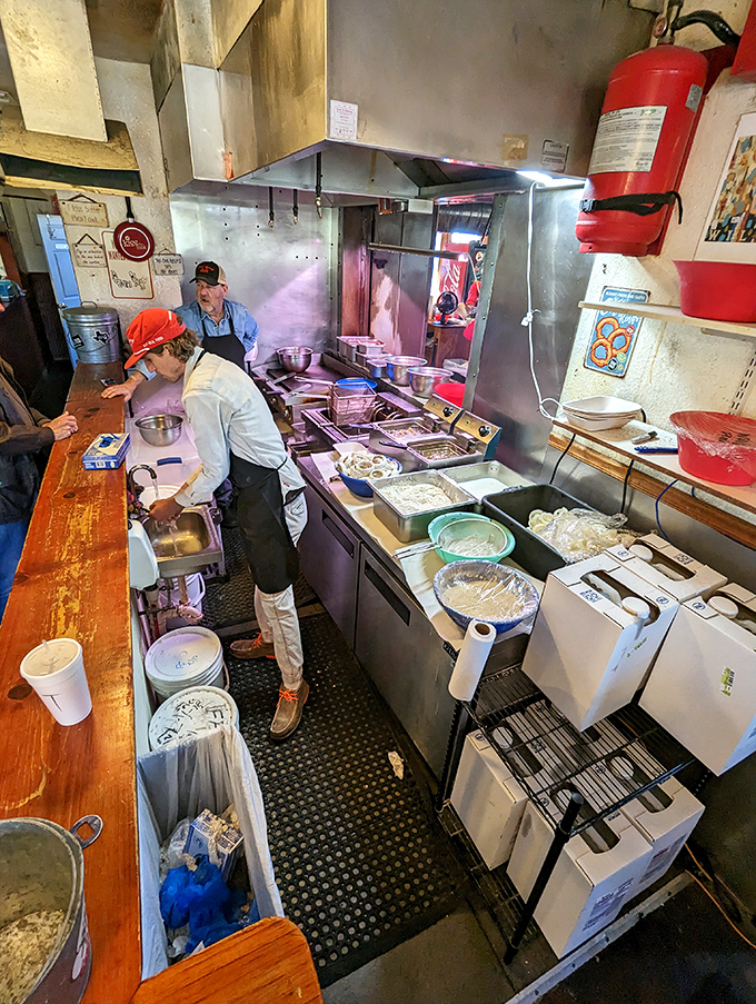 Where burger magic happens. The kitchen crew works with the focused intensity of artists who know their canvas is beef, not linen.