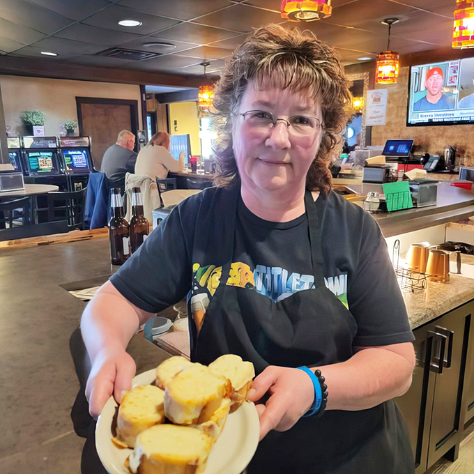 Behind every great restaurant dish is someone who takes pride in serving it. That smile says, "Trust me, you're going to love this."