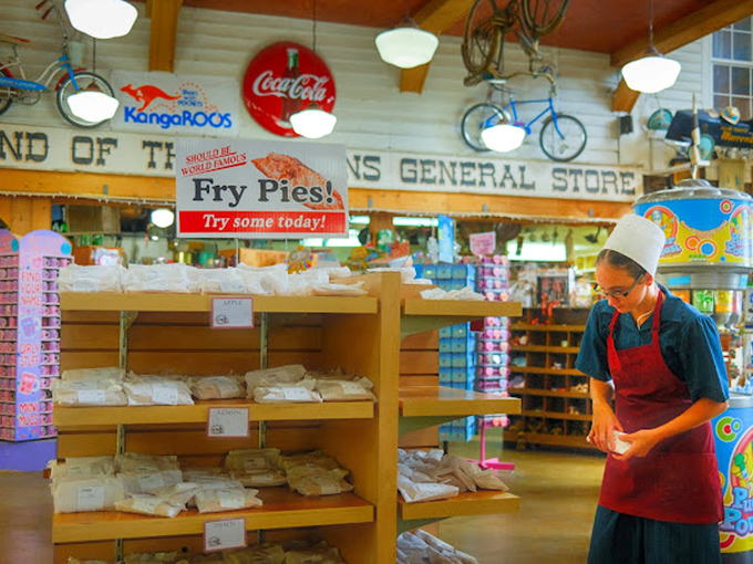 That's not just an Amish worker—that's a guardian of tradition. The Fry Pies sign isn't a suggestion; it's gentle life advice.
