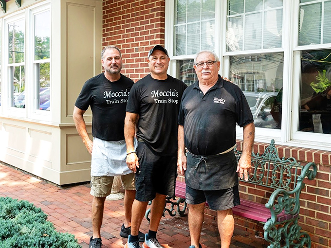 The heart behind the food: dedicated staff members proudly wearing their Moccia's gear outside this beloved Schwenksville institution.