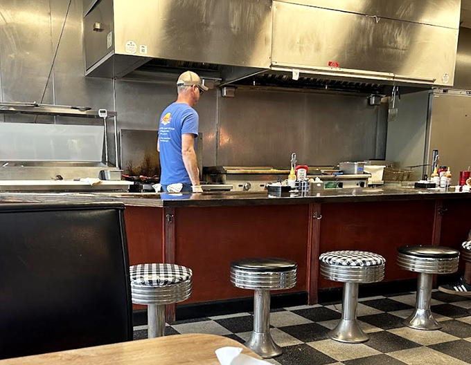 Where the magic happens&mdash;classic diner counter seating that puts you front-row for the culinary show. Those chrome stools have witnessed countless coffee refills.