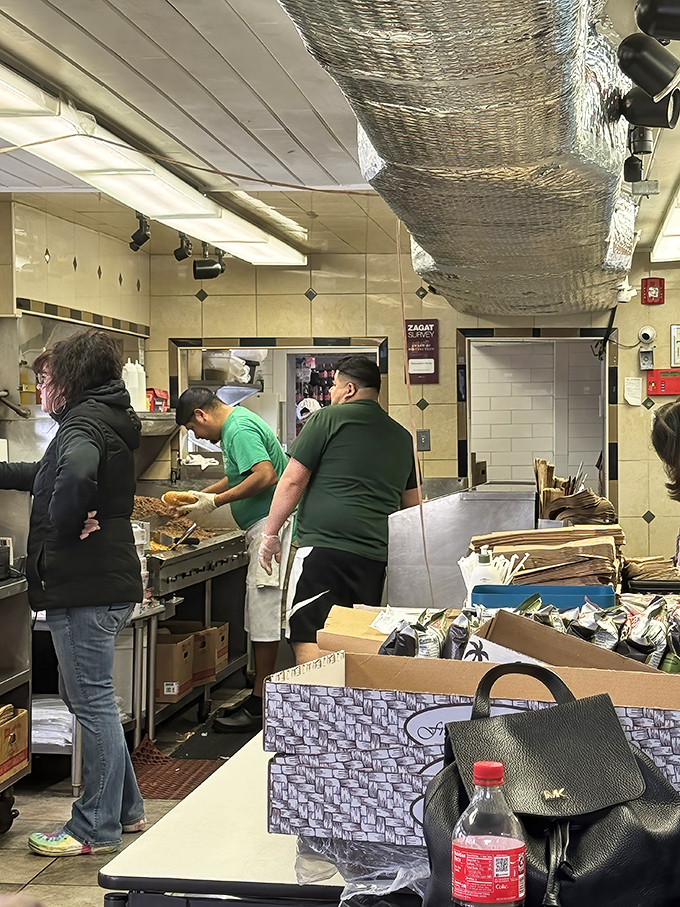 The kitchen crew moves with balletic precision. Years of experience translated into the perfect chop, flip, and serve.