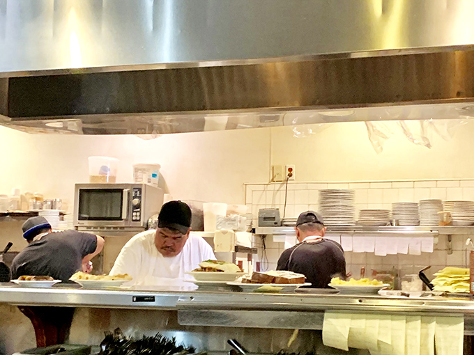 Behind the scenes, kitchen magicians transform simple ingredients into the stuff of breakfast legend with practiced precision.