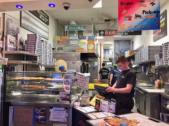 Where pizza magic happens, surrounded by New York street signs. Broadway meets Wall Street meets your taste buds in this compact kitchen.