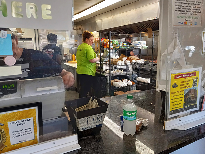 Behind every great sandwich is a dedicated team. These sandwich artists work with practiced precision.