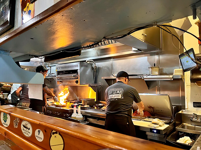 Kitchen staff working with the focused intensity of artists creating edible masterpieces for every single plate.
