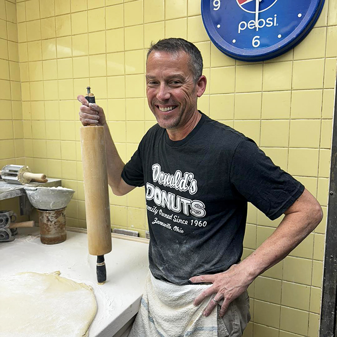 The maestro at work with his trusty rolling pin. Behind every great donut is a dedicated baker who understands that perfection can't be rushed &ndash; or mass-produced.