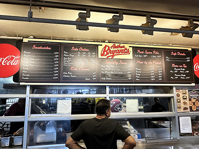 Where BBQ magic happens. That menu board has witnessed countless first-timers transform into lifelong devotees after just one bite.