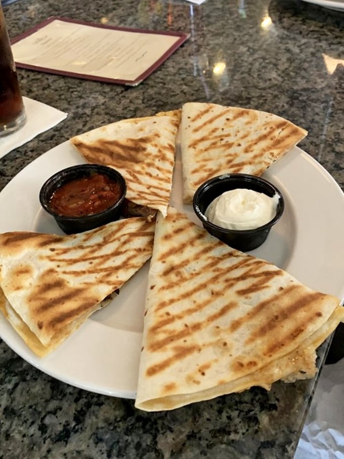 Quesadillas: where the cheese pull is as important as the flavor. That grilled exterior promises the perfect crunch-to-gooey ratio.