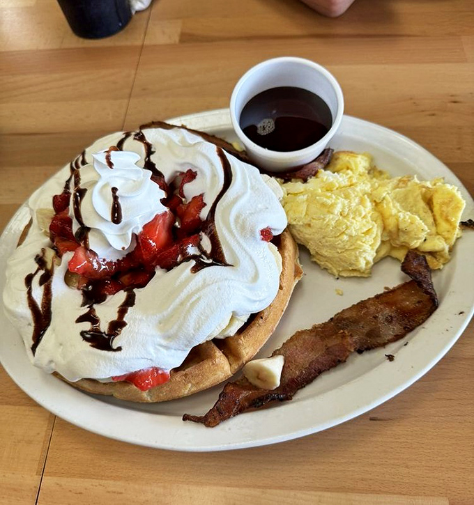 Breakfast dessert or dessert breakfast? The philosophical question becomes irrelevant when faced with this whipped cream mountain atop waffle paradise.