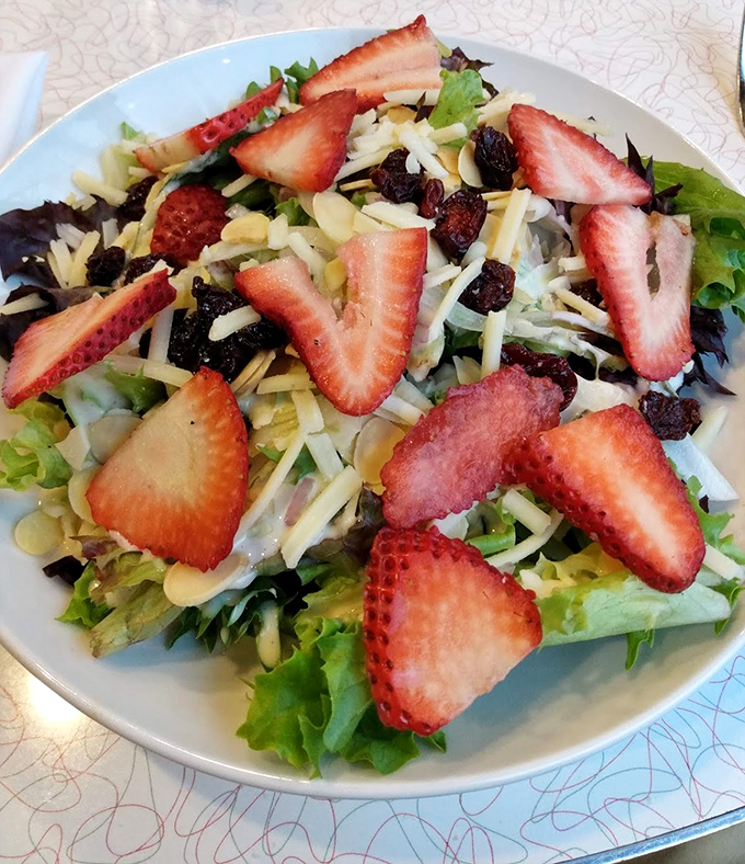 A strawberry salad that brings together nature's candy with cheese and greens&mdash;proof that healthy eating needn't be punishment.