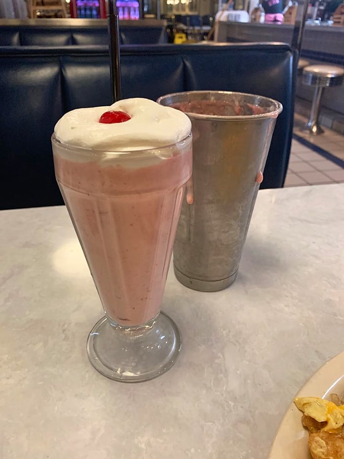 Pink happiness in a classic fountain glass. This strawberry shake isn't just a drink, it's a time machine back to simpler days.
