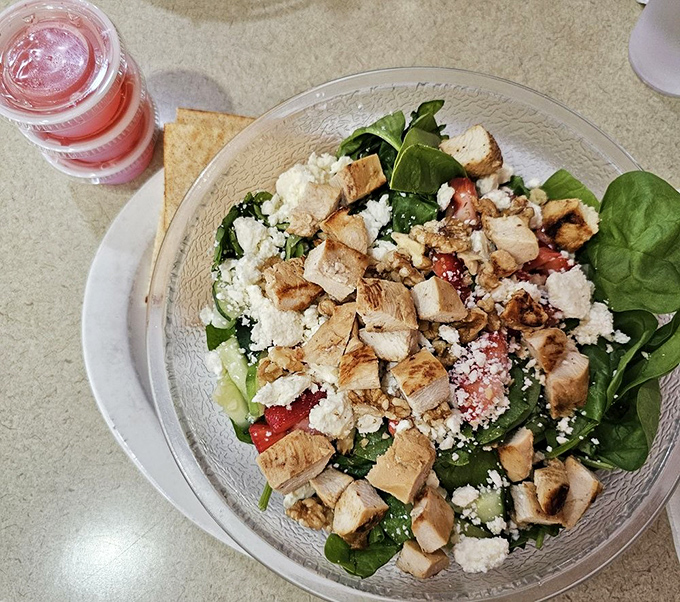 A salad that doesn't apologize for being healthy—it's too busy showing off its grilled chicken, fresh greens, and feta swagger.