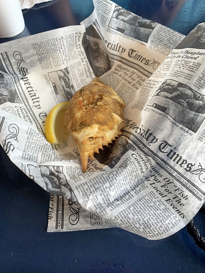 The stuffed blue crab arrives on newspaper like a delicious time capsule from Old Florida. This isn't just food&mdash;it's edible coastal heritage.