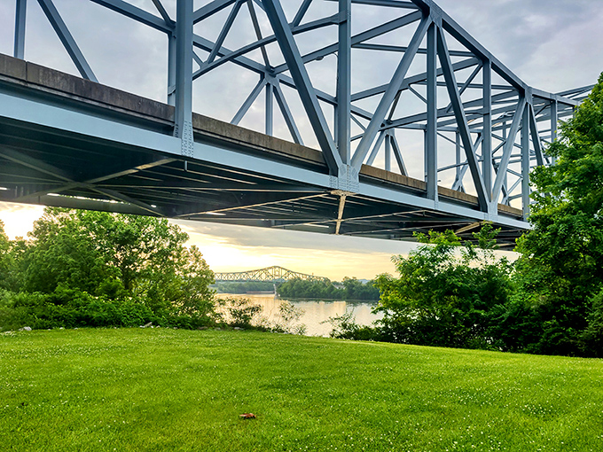 The Silver Memorial Bridge spans the Ohio River, connecting states and stories. Sunset transforms industrial steel into something almost poetic.
