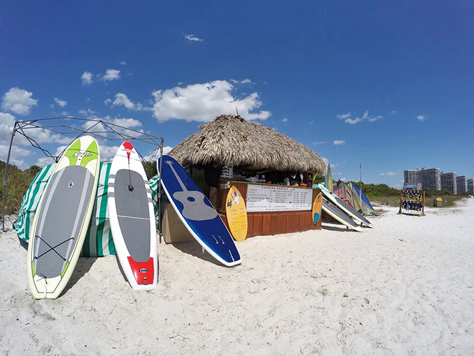 Beach entrepreneurs know what visitors crave. These colorful boards promise adventures beyond where your feet can take you.