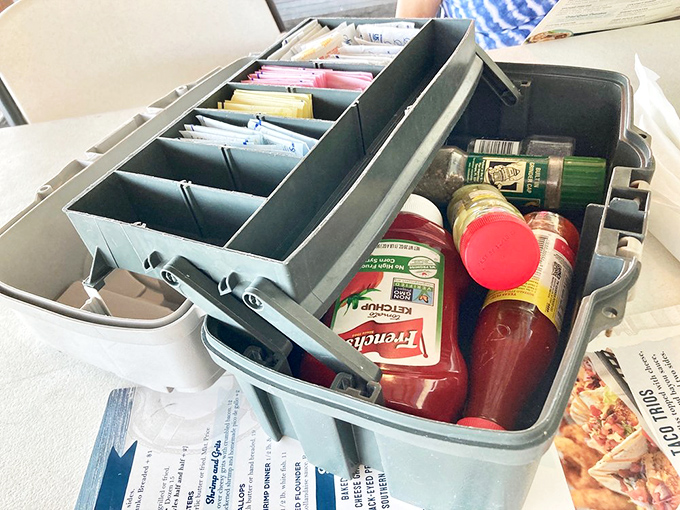 The tackle box condiment carrier isn't just clever—it's the perfect metaphor for this place: practical, unpretentious, and utterly Florida.