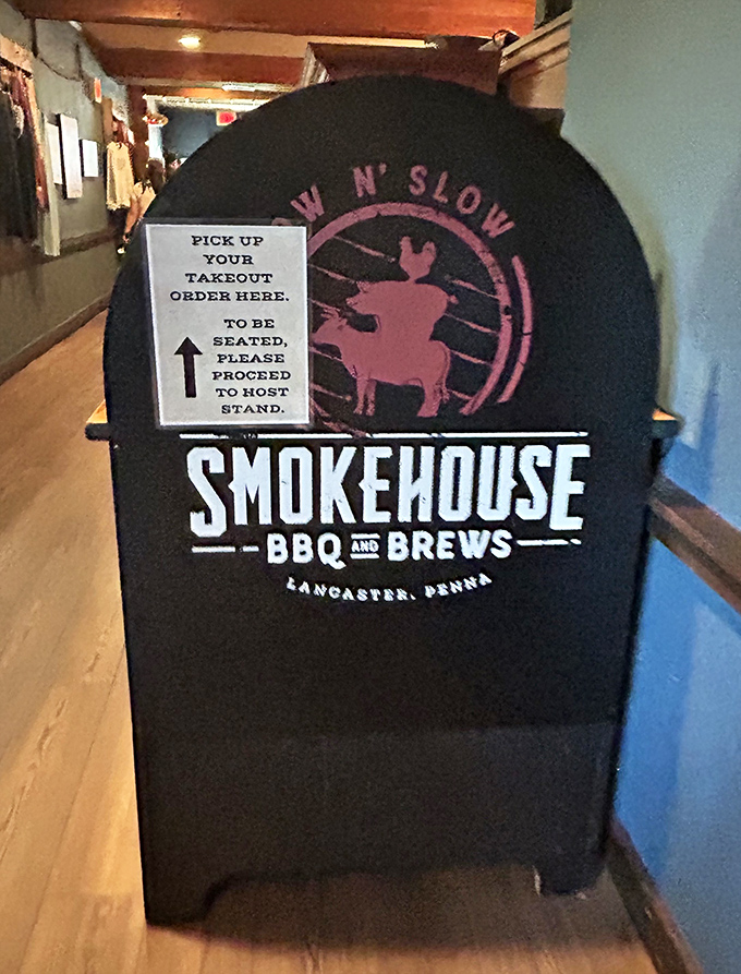 The smoker-shaped sign directing hungry patrons is both practical and thematic &ndash; barbecue wayfinding at its finest.