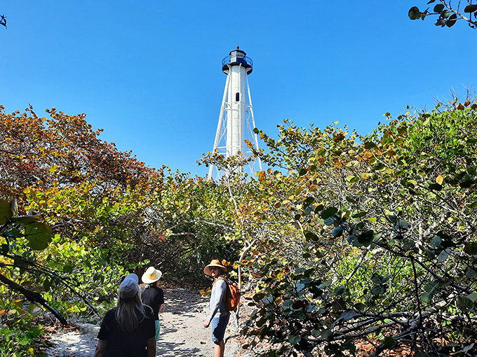 Nature creates the perfect frame for this architectural marvel, with sea grape tunnels leading to a towering white surprise.