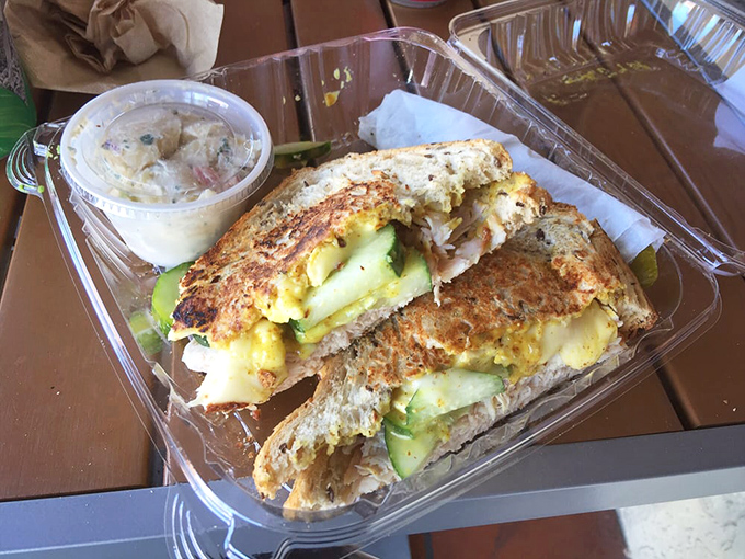 The turkey-cucumber-brie combo: sophisticated enough for lunch with the queen, casual enough for eating in your car. That side of coleslaw? Non-negotiable.