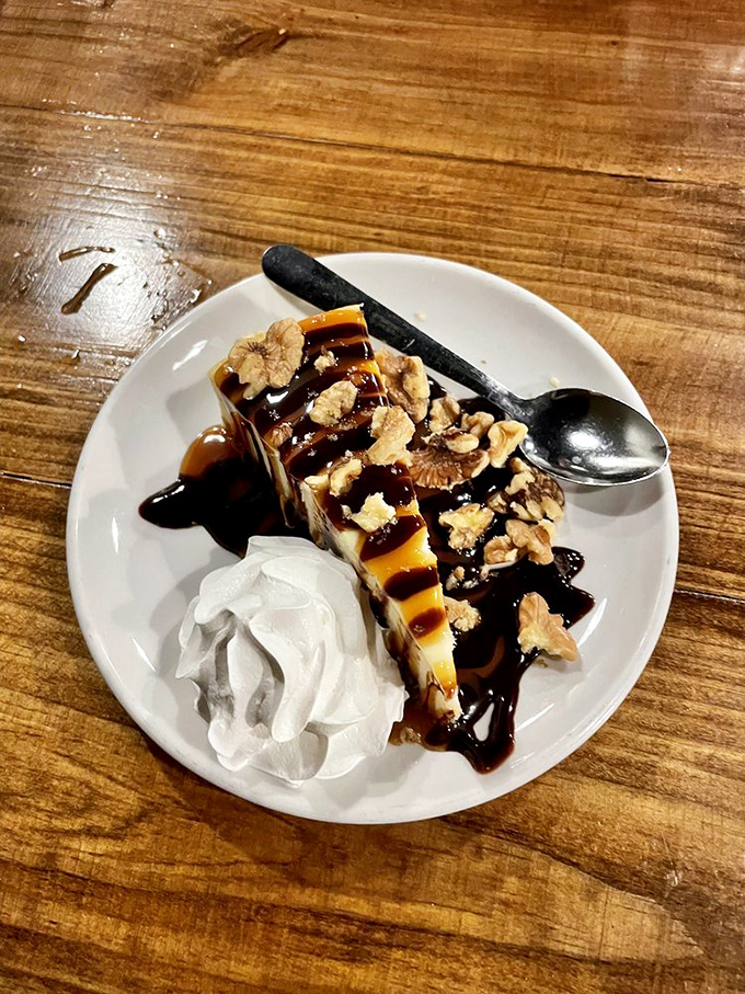 Turtle cheesecake with a drizzle of caramel and chocolate that makes you wonder why you ever considered saving room for dessert.