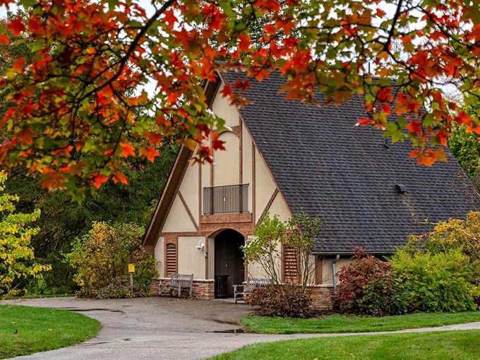 This storybook cottage could house elves or hobbits. Fall maple leaves add a fiery crown to this charming structure straight from a fairytale.