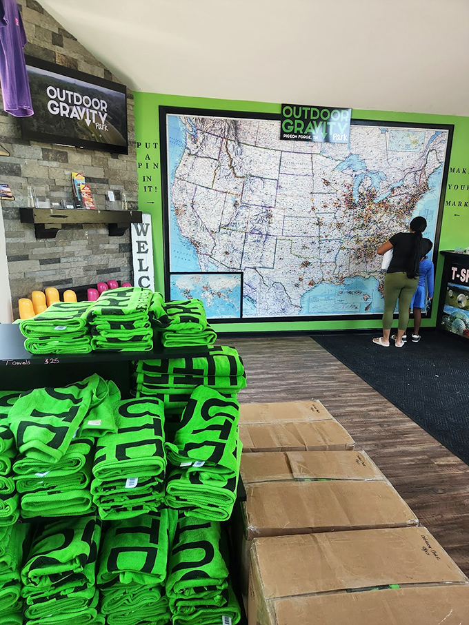 Visitors pin their hometowns on this massive map, proving people will travel surprisingly far for the privilege of being thoroughly discombobulated.