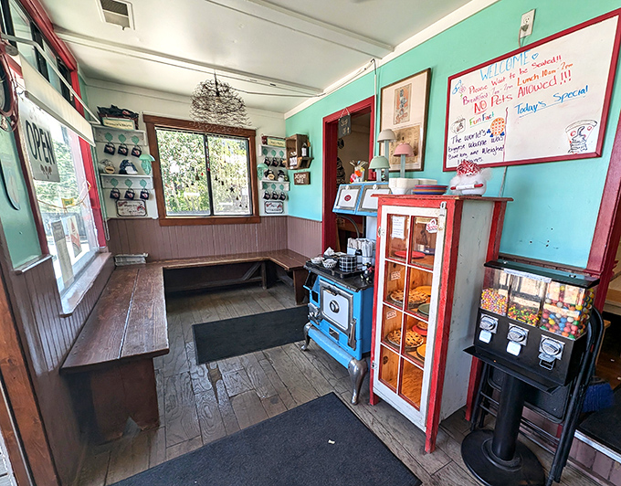 The waiting area where anticipation builds and the vintage blue stove reminds you why you came. Those handwritten specials on the board? Pure temptation.