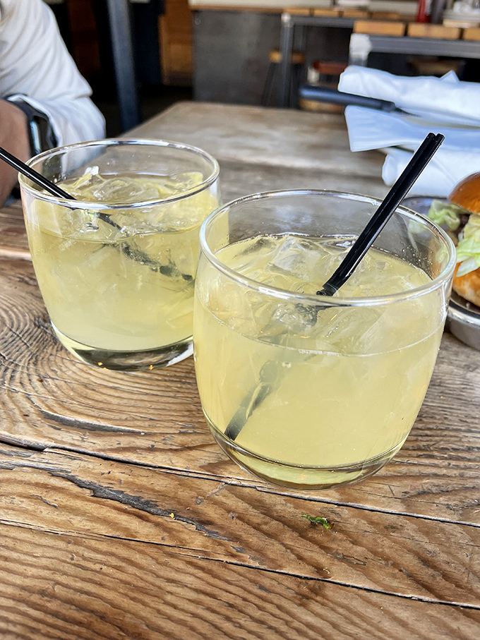 Two whiskey sours waiting to cut through the richness. These aren't just drinks; they're strategic barbecue companions.