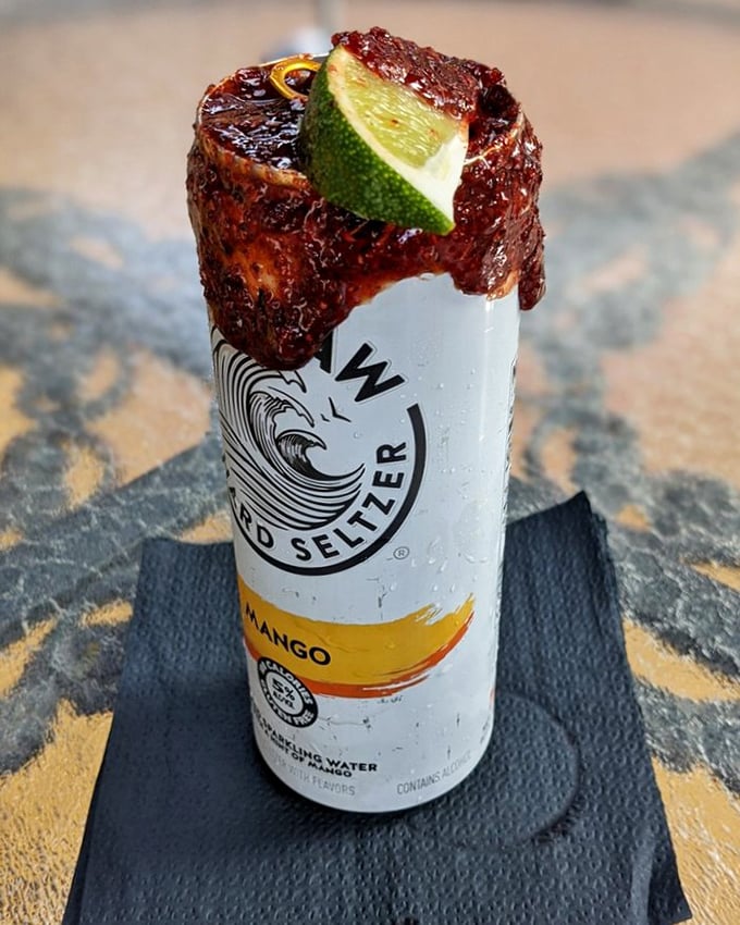 A White Claw transformed into cocktail royalty with that caramelized rim and lime. Beach drink meets culinary ambition in one tall can.