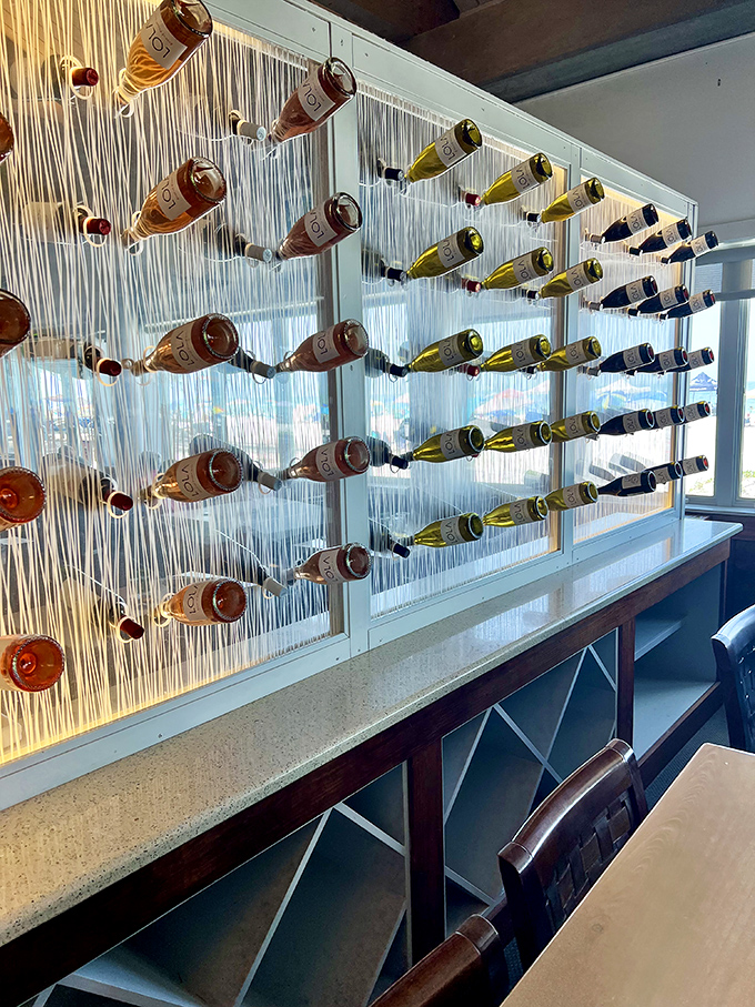 Wine bottles suspended like buoys in an ocean of possibilities. Choosing becomes a delightful dilemma.