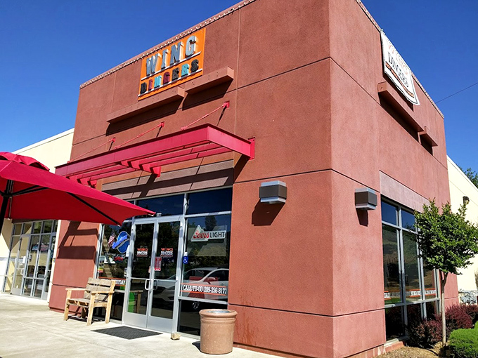 Wing Dingers' vibrant exterior promises flavor without pretension—the kind of place where your taste buds celebrate while your credit card breathes a sigh of relief.