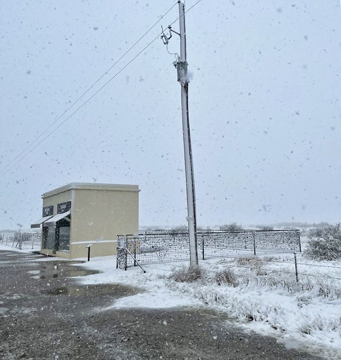 Winter whites take on new meaning when snow blankets Prada Marfa. Fashion's most remote outpost looks surprisingly at home in its cold-weather couture.