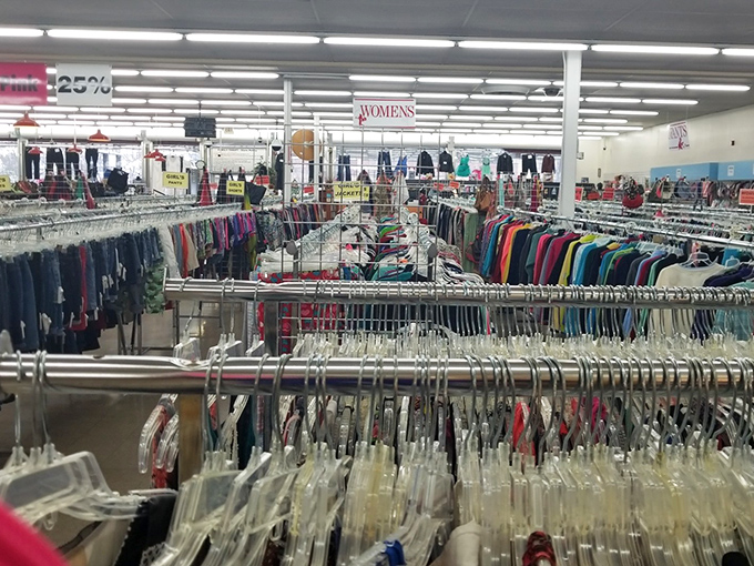 The women's section stretches endlessly, a sea of hangers where designer labels occasionally hide among fast fashion castoffs like diamonds in the rough.