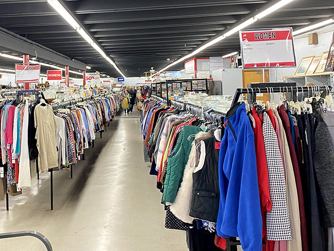 The women's section stretches into the horizon. These racks have witnessed countless "Does this still fit?" moments and triumphant "I can't believe I found this!" victories.